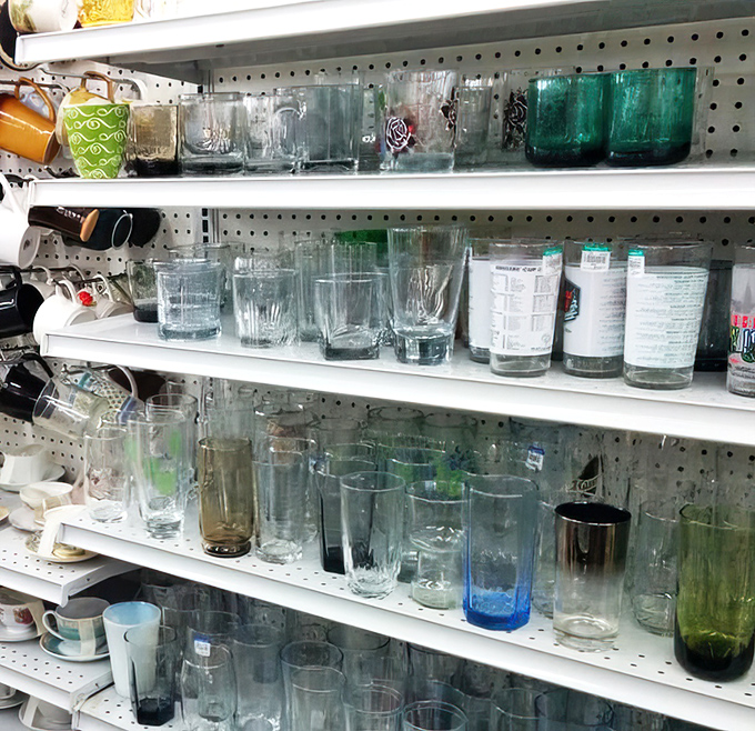 Glassware arranged with surprising sophistication &ndash; mismatched sets waiting to become the talk of your next dinner party.