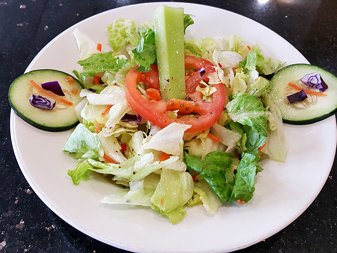A garden of freshness on a plate &ndash; their Greek salad offers a crisp counterpoint to the pizza indulgence that awaits.