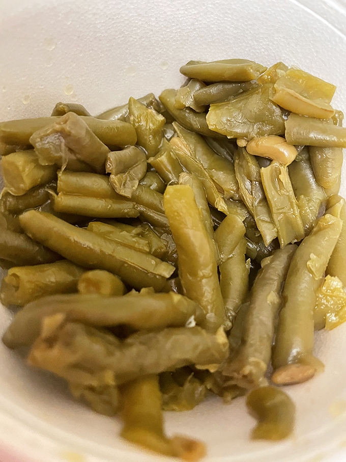 These green beans have clearly been simmering with purpose, absorbing flavors that transform them from simple vegetable to Southern statement piece.