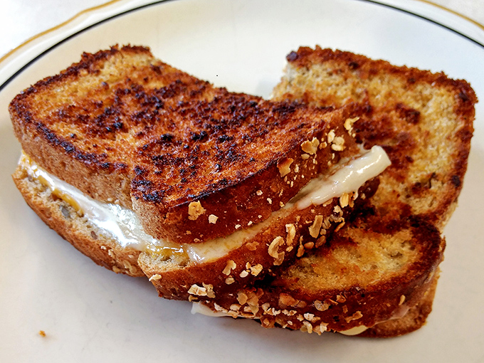 Grilled cheese perfection that makes you wonder if they've somehow installed a portal to your grandmother's kitchen circa 1975.