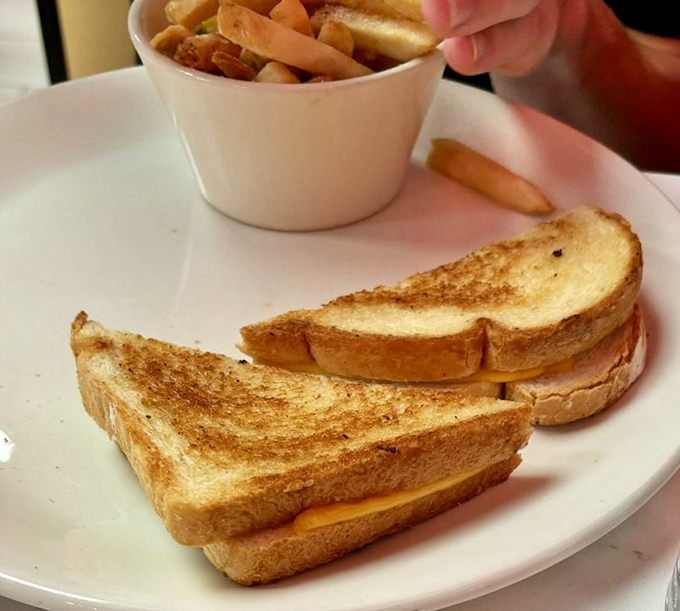 The humble grilled cheese, elevated to art form. Pair with tomato soup for a combination more perfect than Sinatra and New York.