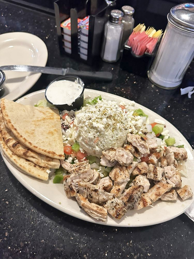 The chicken platter with pita and tzatziki &ndash; proof that Mediterranean flavors thrive in Florida's sunshine just as beautifully as palm trees.
