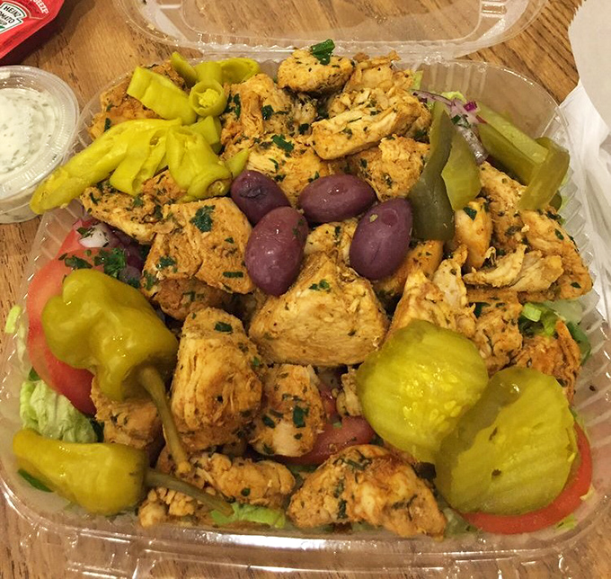 Fresh vegetables meet marinated chicken in a salad that makes healthy eating feel like cheating on your diet.