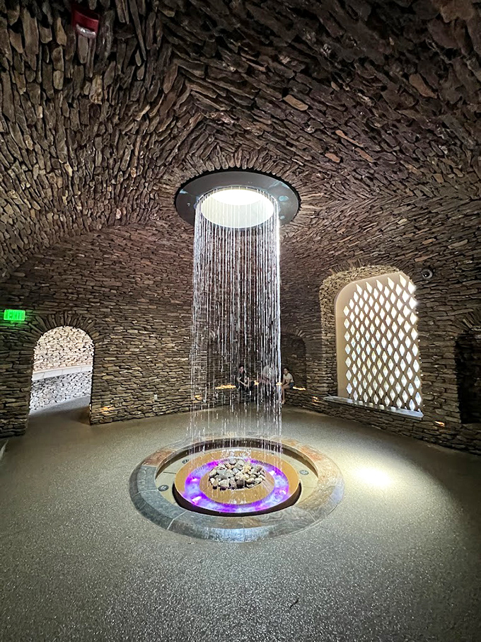 Stone meets water in this mesmerizing grotto. The ceiling rainfall creates a meditative space that's part ancient temple, part luxury spa experience.