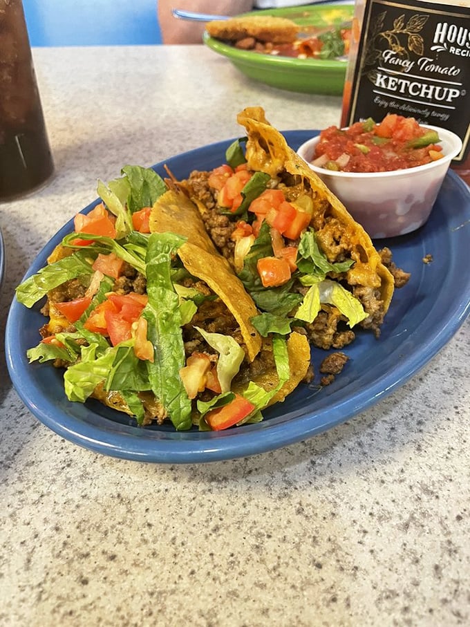 Ground beef tacos arrive perfectly crispy, loaded with toppings that prove simple done right beats fancy every time.