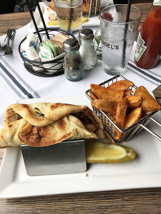 This wrap and those golden potato wedges are comfort food elevated to an art form. The pickle is not just a garnish – it's essential balance.