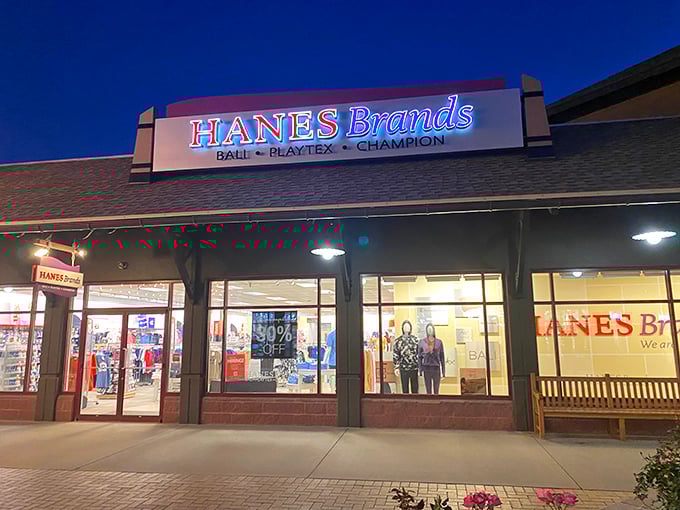 Hanes Brands illuminates the night with promises of basics at bargain prices. The window display silently judges your worn-out underwear drawer from afar.