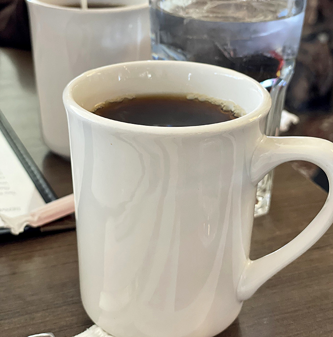 Coffee in a sturdy mug&mdash;no fancy latte art needed. The kind that says, "Good morning" with authority rather than whispering it poetically.