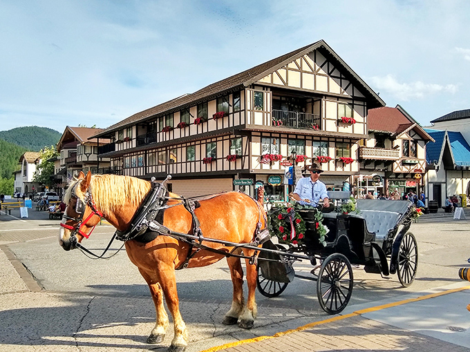 A chestnut-colored draft horse pulls a carriage past Bavarian storefronts, offering rides that are equal parts transportation and time machine.