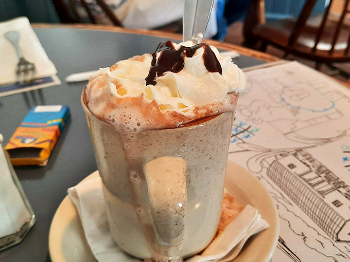 Hot chocolate that doesn't just warm your hands but hugs your soul. That whipped cream mountain with chocolate drizzle deserves its own zip code.