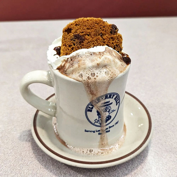 Hot chocolate topped with a slice of cake&mdash;because sometimes one dessert simply isn't enough to heal what ails you.