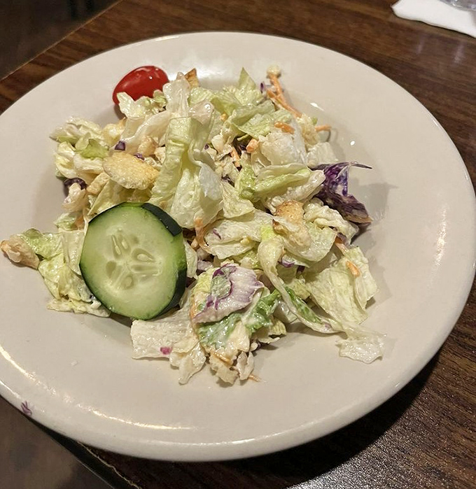 Fresh, crisp house salad with cucumber and tomato proves even the simple things get proper attention here.