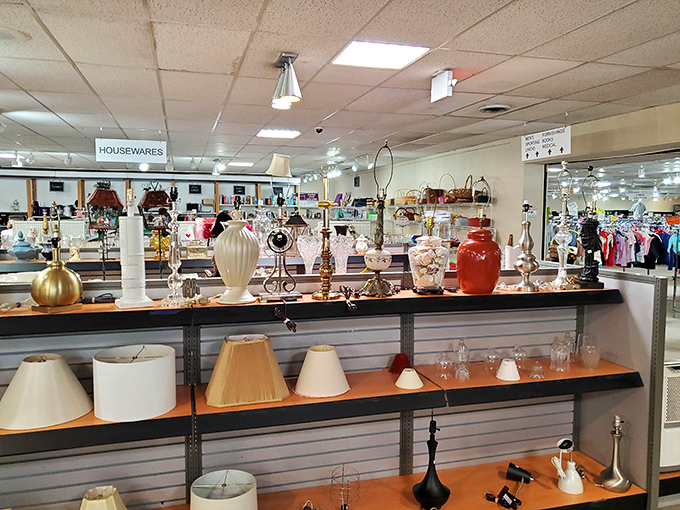 Lamp shades and decorative vessels create a display worthy of an upscale boutique. One person's discarded vase is another's perfect mantel accent.