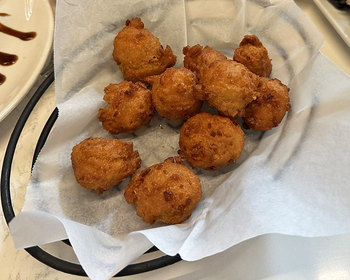 Hush puppies so perfectly golden they should come with a warning: "May cause involuntary food noises."