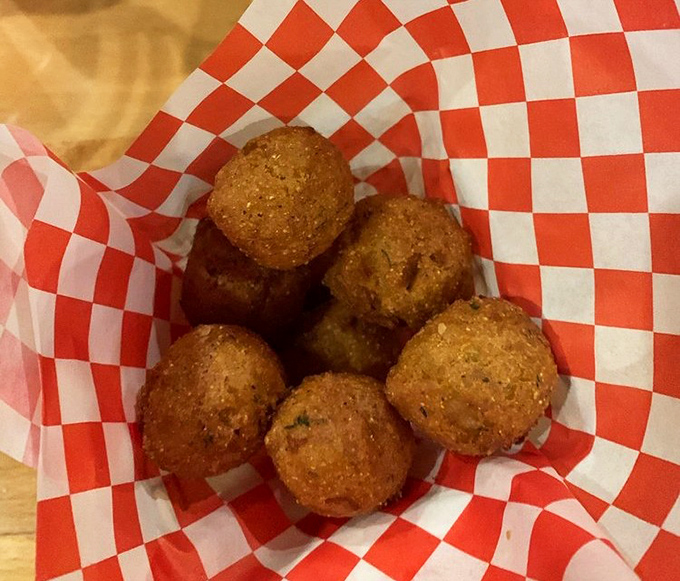 Hush puppies so perfectly golden, they're the unsung heroes of the seafood feast. Crispy outside, tender cornmeal heaven inside.