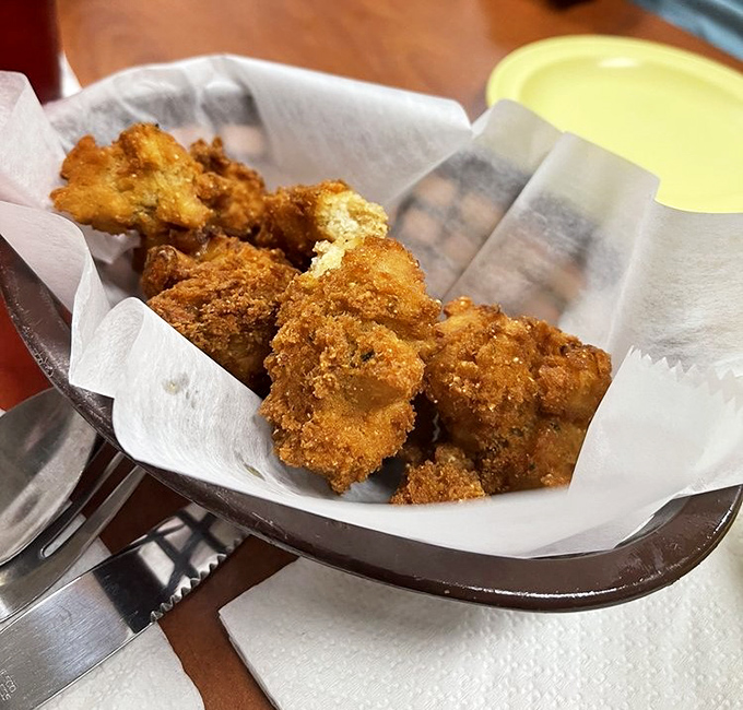Hush puppies that speak volumes &ndash; golden-fried cornmeal treasures that manage to be both crispy and tender, the perfect sidekick to any meal.