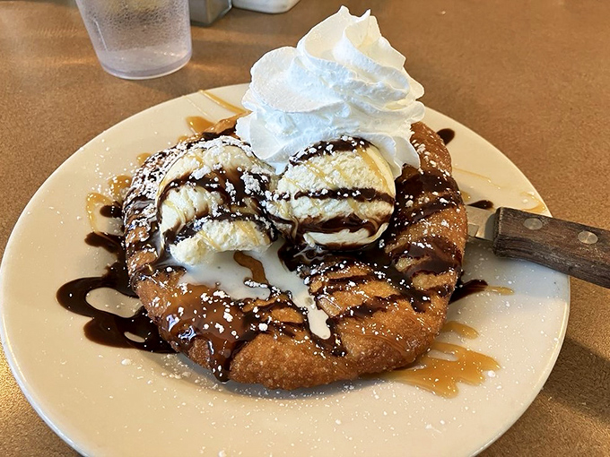 A dessert that doesn't know whether it's breakfast or heaven &ndash; warm pastry crowned with ice cream, whipped cream, and a drizzle of pure joy.