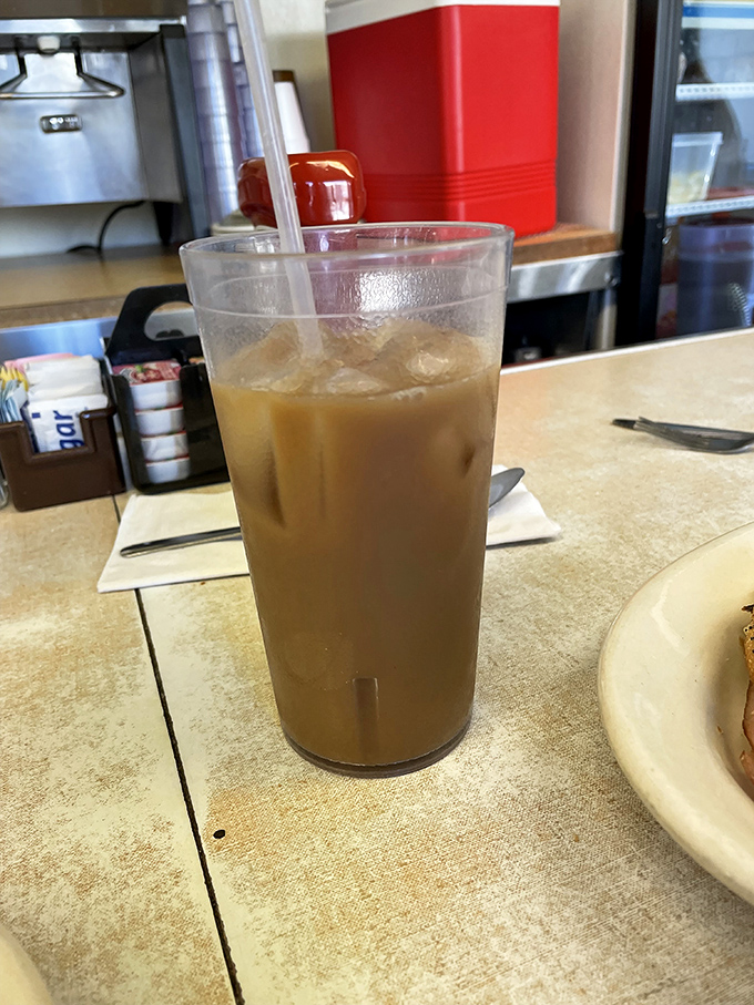 Coffee with that perfect caramel hue—the kind that promises to transform morning zombies into functioning humans with remarkable efficiency.