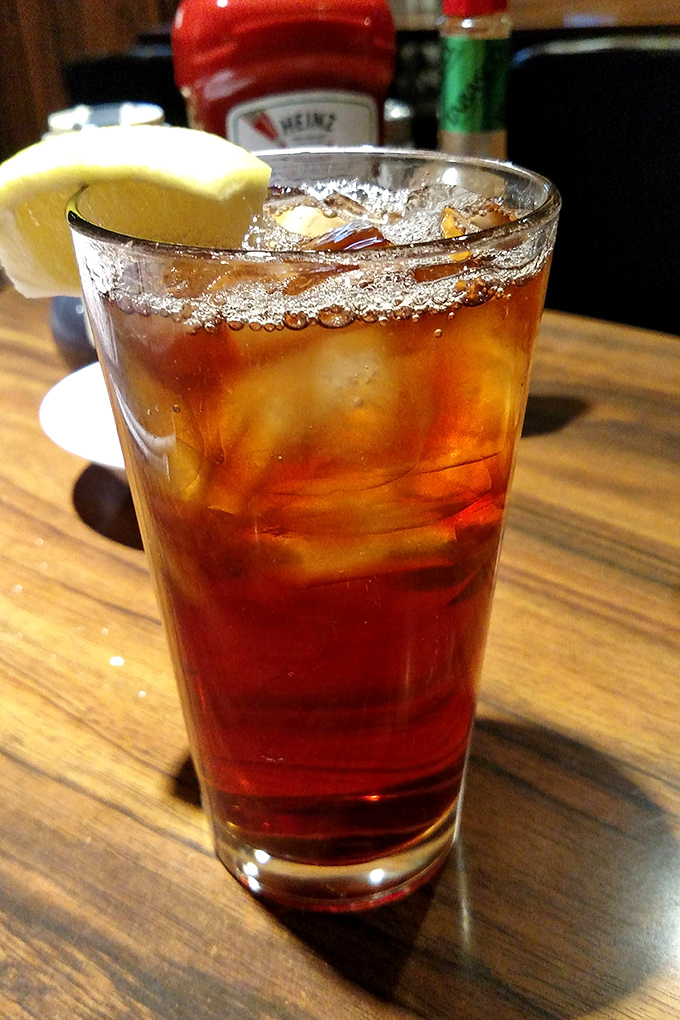 An amber glass of iced tea with a lemon wedge &ndash; the unofficial state beverage of Southern California and perfect companion to any meal.