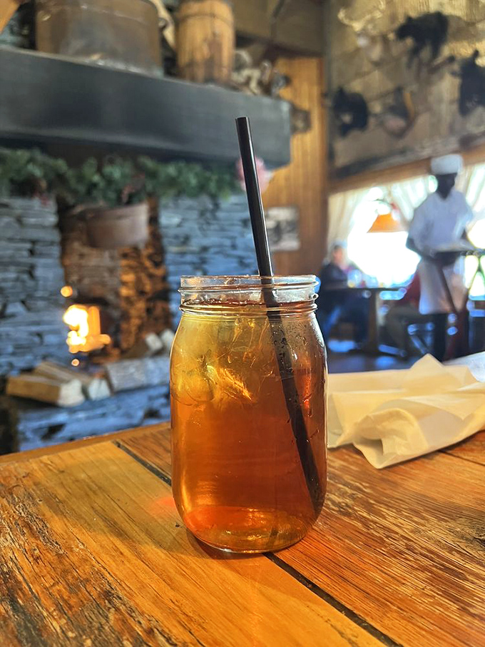 Sweet tea served in a mason jar&mdash;because in the South, proper hydration comes with tradition and enough sugar to power your Smoky Mountain adventures.