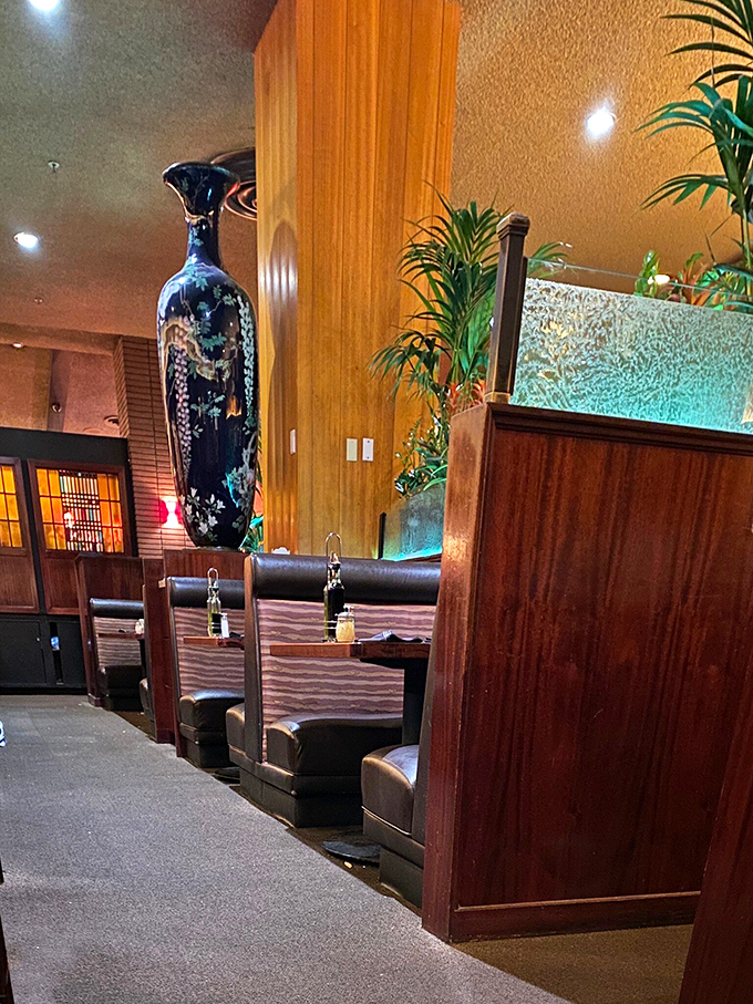 The warm wood tones and elegant booth dividers create dining spaces that feel both intimate and part of something larger &ndash; like your own private Italy.