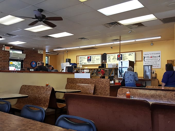 The dining room at OJ's second location carries the same no-nonsense approach to deliciousness&mdash;yellow walls that say "happiness served here daily."