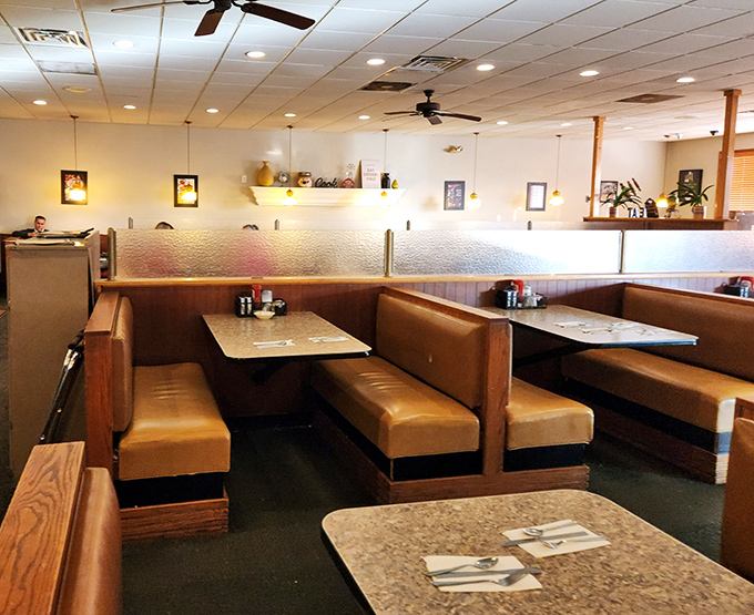 The dining room layout follows the golden rule of diners: everyone deserves a comfortable booth and a clear path to the dessert case.