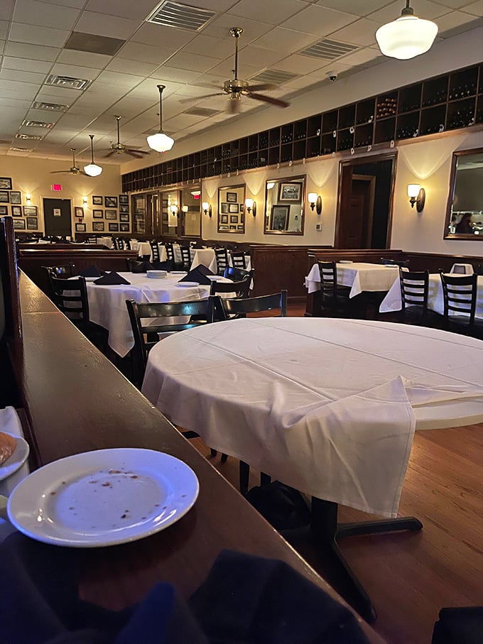 The dining room waits in quiet anticipation, like a Broadway theater before the curtain rises on your steak-centered performance.