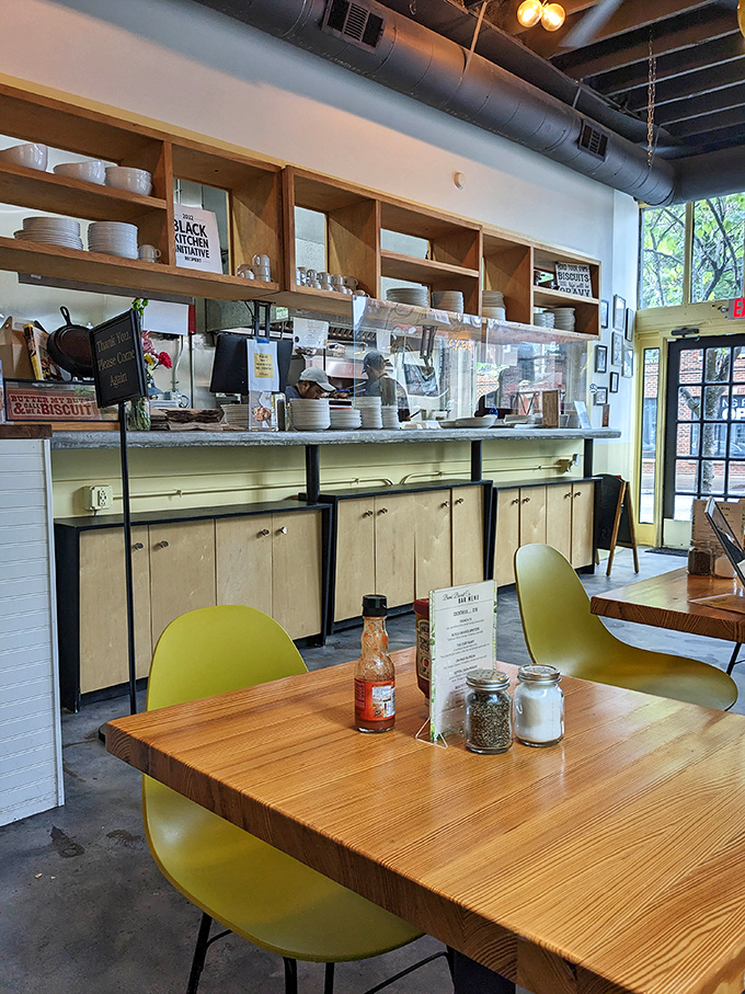 The open shelving and bright interior create a space where comfort food meets contemporary design, like grandma's recipes in millennial packaging. 