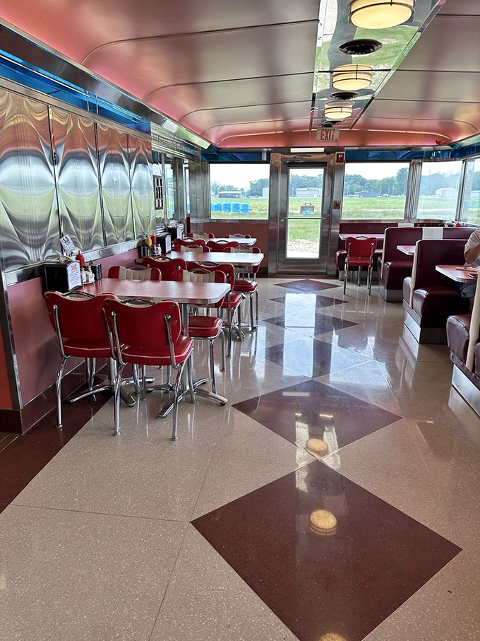 The diner's polished interior gleams under soft lighting, where every table offers a front-row seat to the timeless theater of American comfort food.