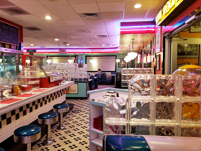 Chrome, tile, and neon create the holy trinity of diner design, where every booth feels like the best seat in the house.