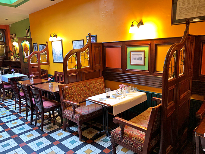 Rich colors and thoughtful design create intimate dining spaces where conversations flow as easily as the wine. Notice the absence of distracting TVs.