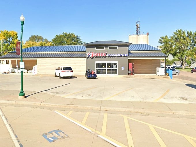 Jones' Food Center proves small towns can have big grocery game. The wooden reception counter says "welcome" better than any corporate slogan.