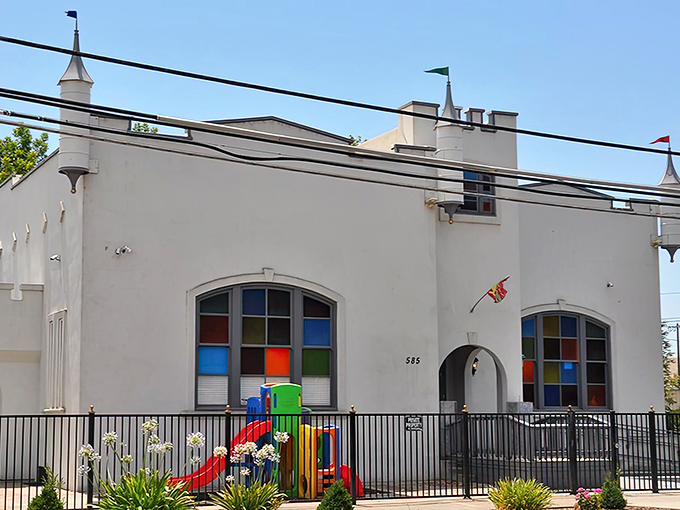 This charming castle-inspired building houses childhood dreams and playground adventures, no expensive theme park tickets required.