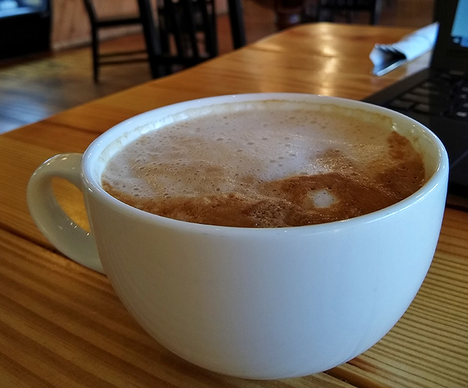 A steaming latte with perfect foam art proves Cleveland Vegan takes every aspect of your experience seriously.