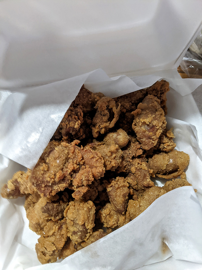 These chicken livers aren't just food; they're a test of character. Perfectly fried, they convert skeptics into evangelists with one crispy bite.