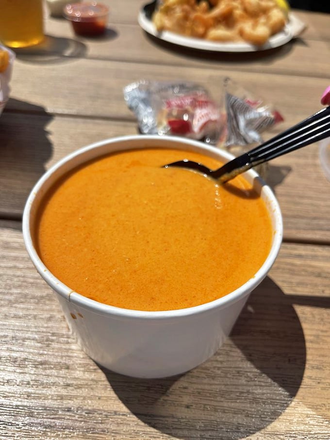 Lobster bisque the color of a perfect sunset, with a richness that makes you want to propose marriage to your soup spoon.