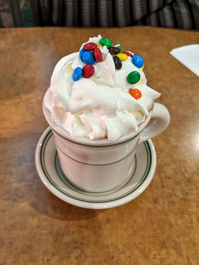 Hot chocolate that doesn't know when to stop. Those M&Ms are like confetti celebrating your excellent beverage choice.