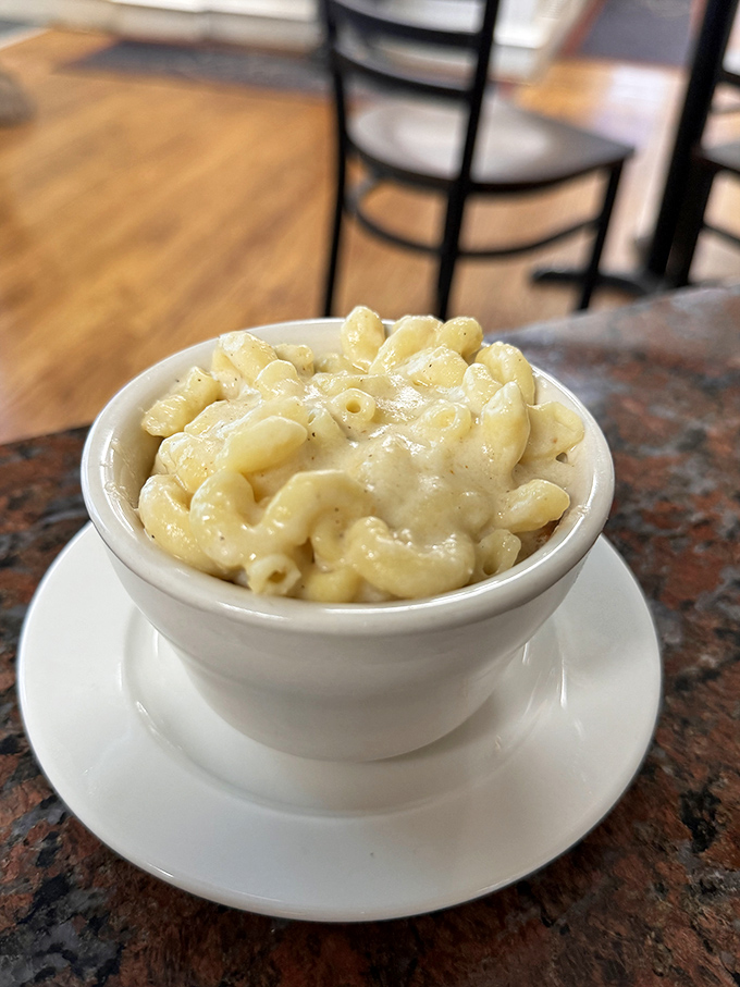 Mac and cheese that makes adults fight children for the last spoonful&mdash;creamy, cheesy, and unapologetically indulgent in its simple white bowl.