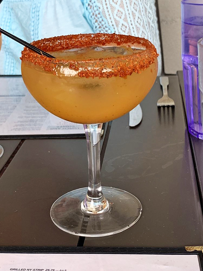 That's not just a margarita&mdash;it's liquid sunshine with a chile-salt rim that perfectly balances sweet, sour, and spicy in one gorgeous glass. 