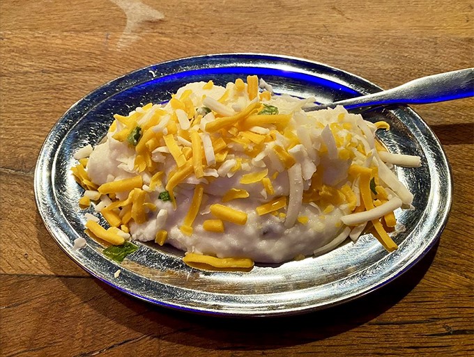 Comfort food speaks all languages. This creamy mashed potato mountain topped with melted cheese is fluent in "you'll be back for seconds."