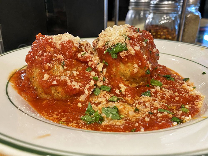 Meatballs so perfectly spherical they could make a geometry teacher weep with joy. That sauce? It's speaking Italian to your taste buds.