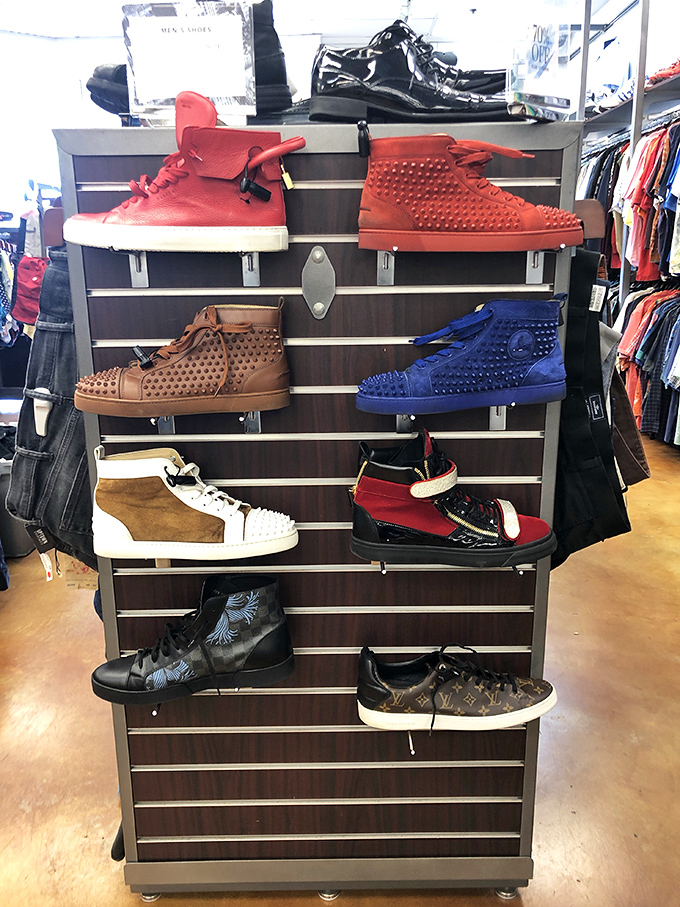 Designer sneakers arranged like rare artifacts in a museum of modern style. Proof that secondhand doesn't mean second-rate.