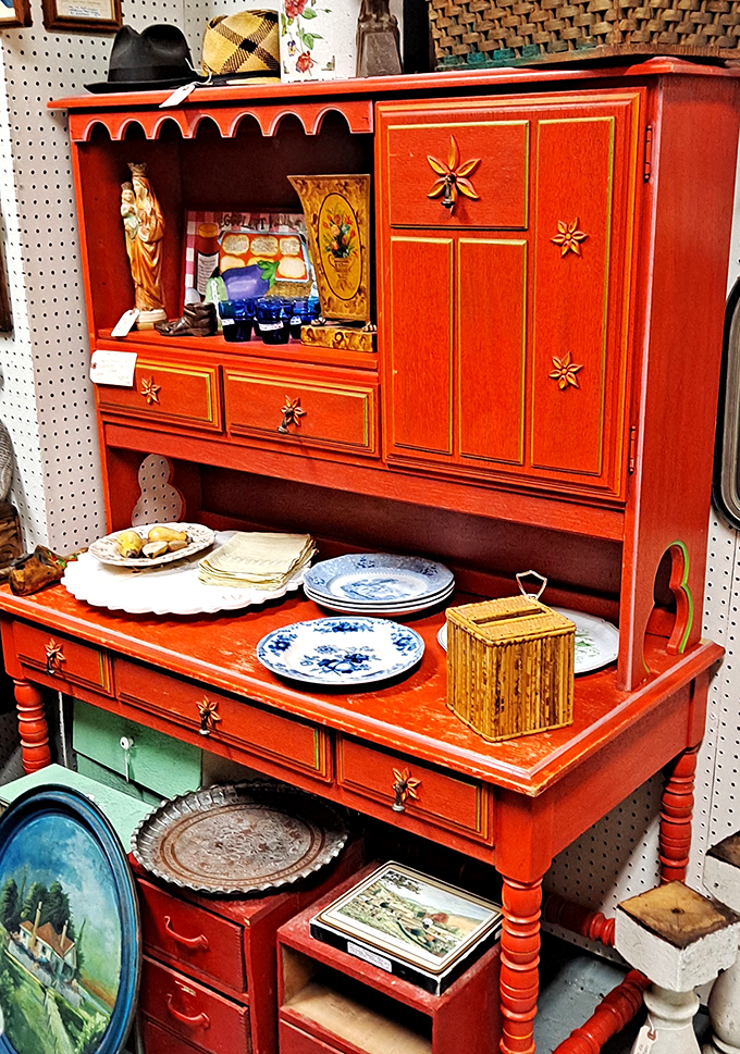 This vibrant red provincial-style hutch isn't just furniture &ndash; it's a statement piece that says "my home decor has a backstory."