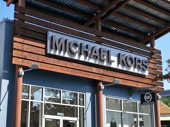 Michael Kors: where handbags that normally require a small loan suddenly seem like reasonable life choices at outlet prices.