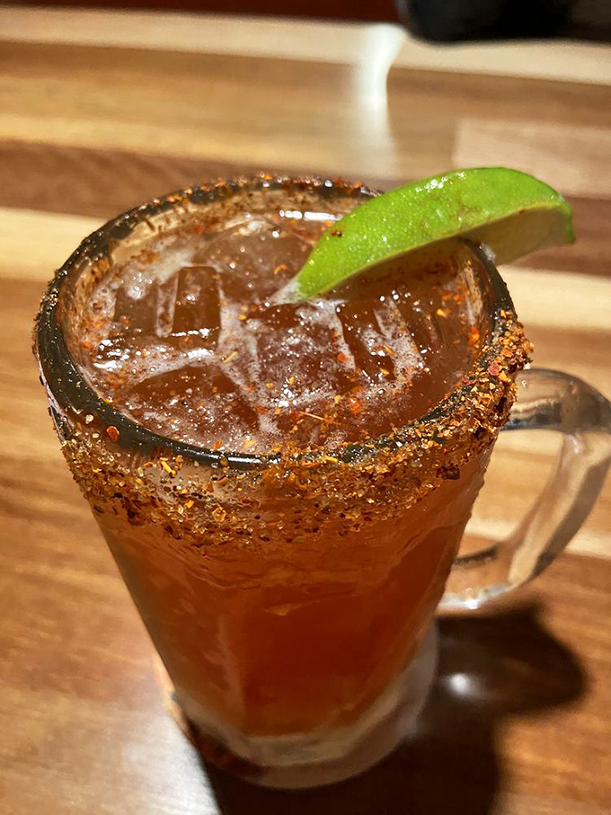 A spicy michelada with its chili-salt rim stands ready to cool the fire of seafood adventures&mdash;like a lifeguard for your taste buds.