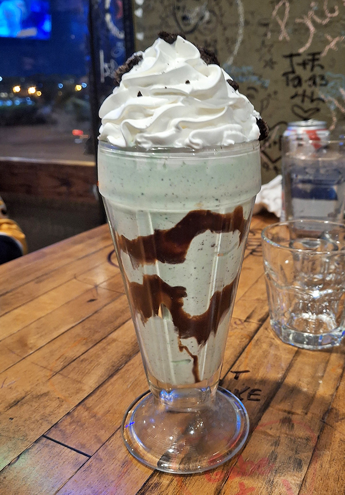 This mint Oreo milkshake isn't just dessert&mdash;it's performance art in a glass, layered with cookie crumbles and topped with a cloud of whipped cream. 