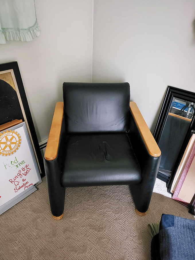 This leather armchair has seen some living but has plenty more to give. Perfect for reading, napping, or pretending you're a Bond villain.
