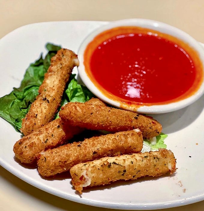 Golden, crispy, cheesy wands of joy served with marinara that's practically singing opera. Mozzarella sticks: proof that God loves us.