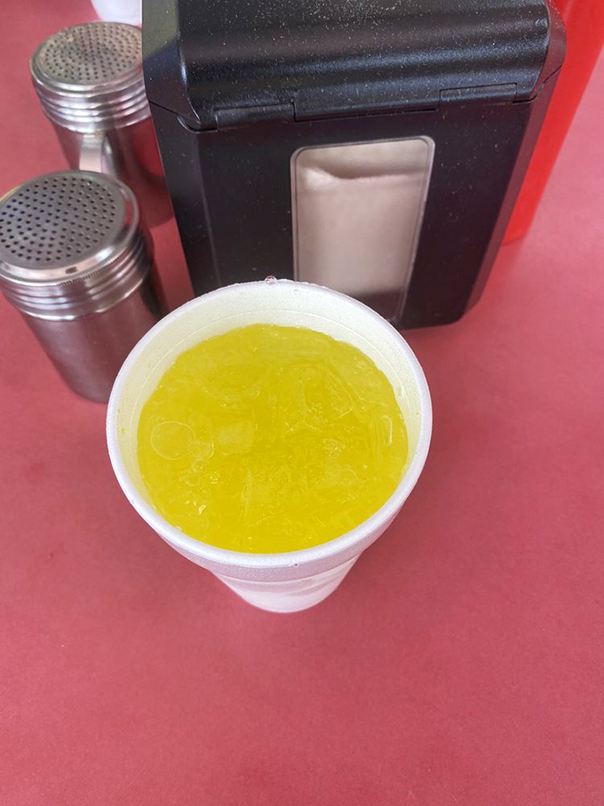 That Mountain Dew isn't just a drink—it's liquid sunshine cutting through burger richness with each effervescent sip.